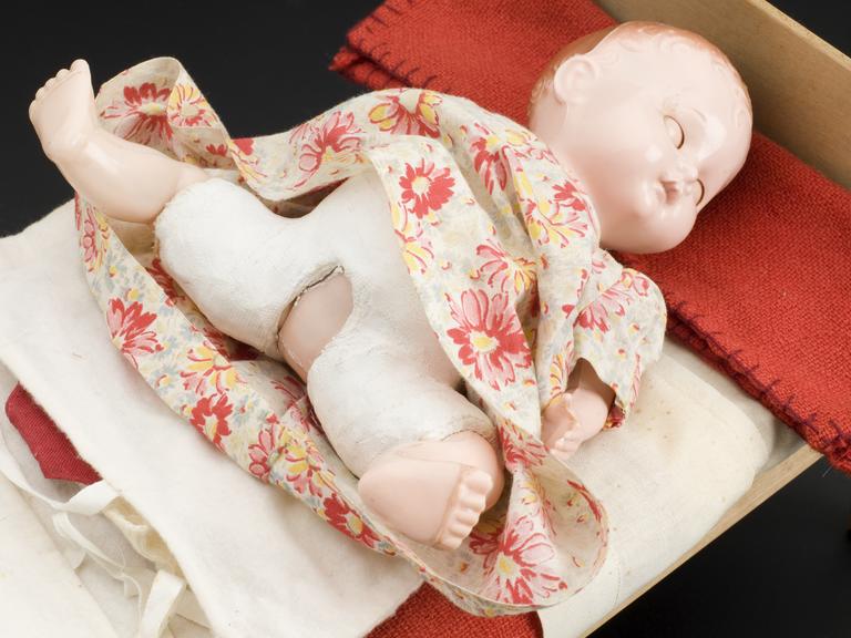 Doll lying in bed to demonstrate medical treatment to children, England ...