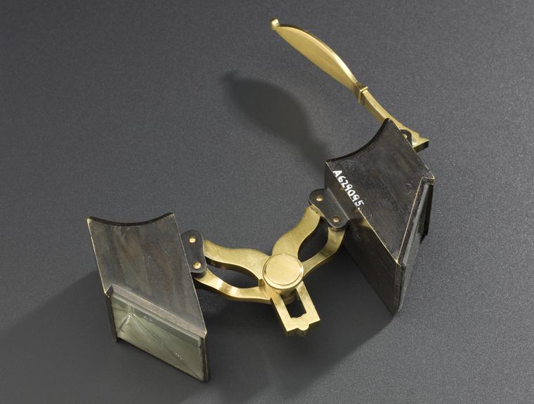 Amblyoscope, with separate prisms for each eye to look through ...