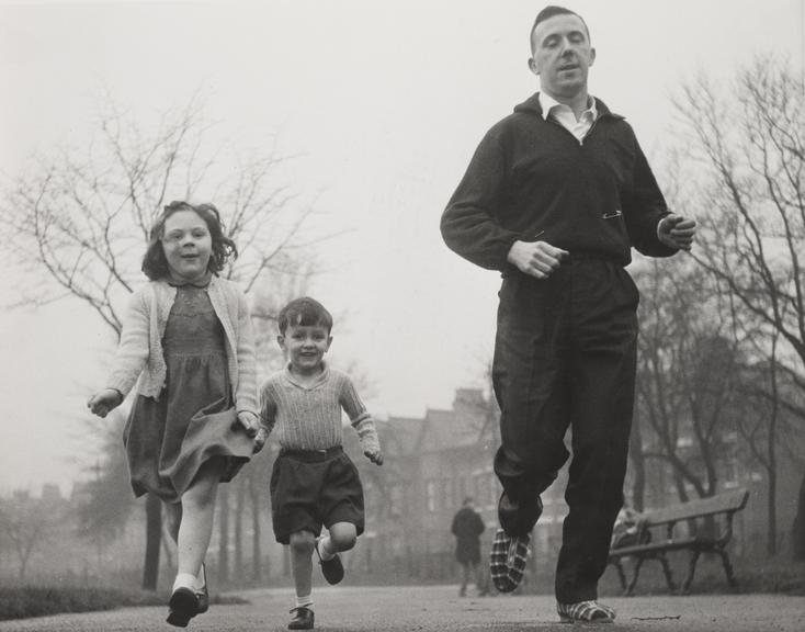 Six year old Carol and three year old Christopher help dad Walter ...