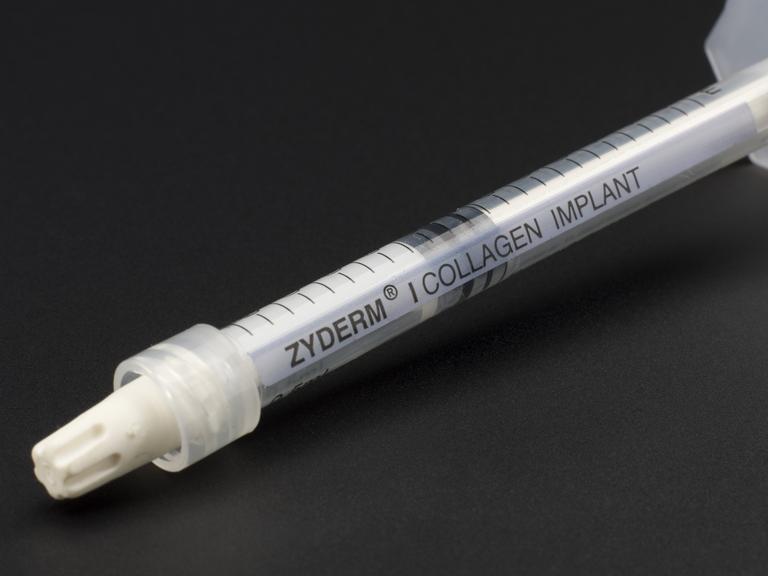 Plastic syringe containing liquid collagen for cosmetic/plastic surgery ...