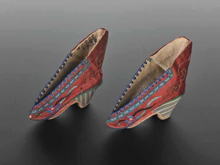 Pair of shoes with decorative embroidery worn by Chinese lady with ...