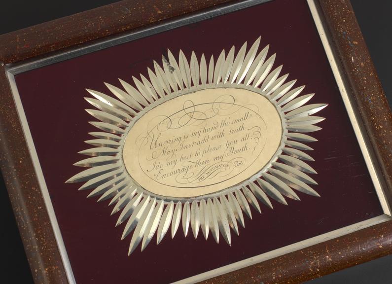 Pen and ink automatic writing on oval sheet of paper, by automaton ...