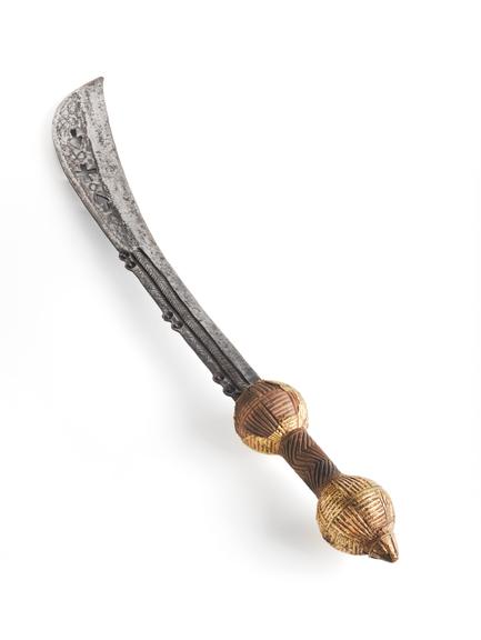 Curved steel ceremonial sword with wooden handle decorated with gold ...
