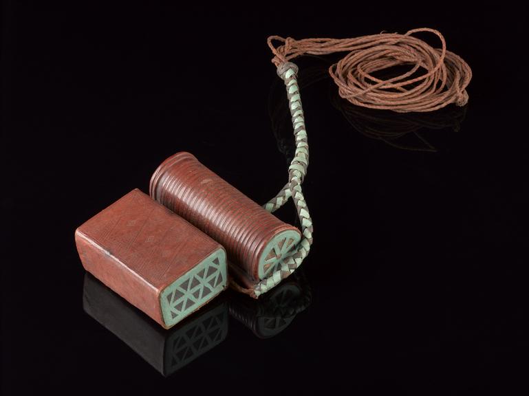Two red leather amulet cases | Science Museum Group Collection