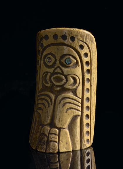 Carved ivory amulet | Science Museum Group Collection