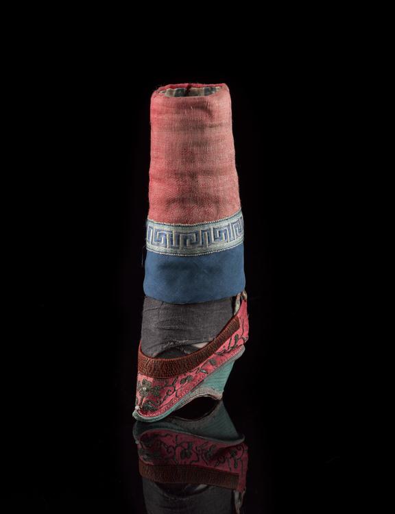 Cast of Chinese lady's deformed foot with legging and embroidered shoe ...