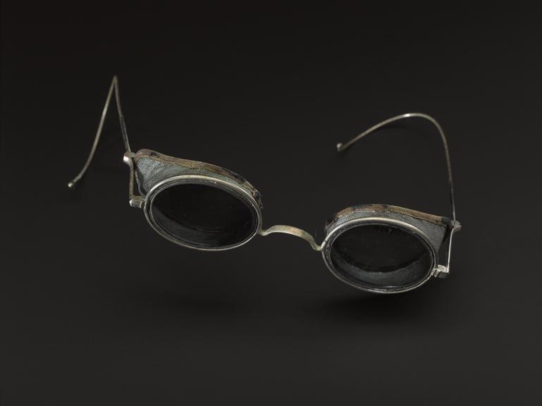Pair of metal-rimmed spectacles with wire mesh protecters | Science ...