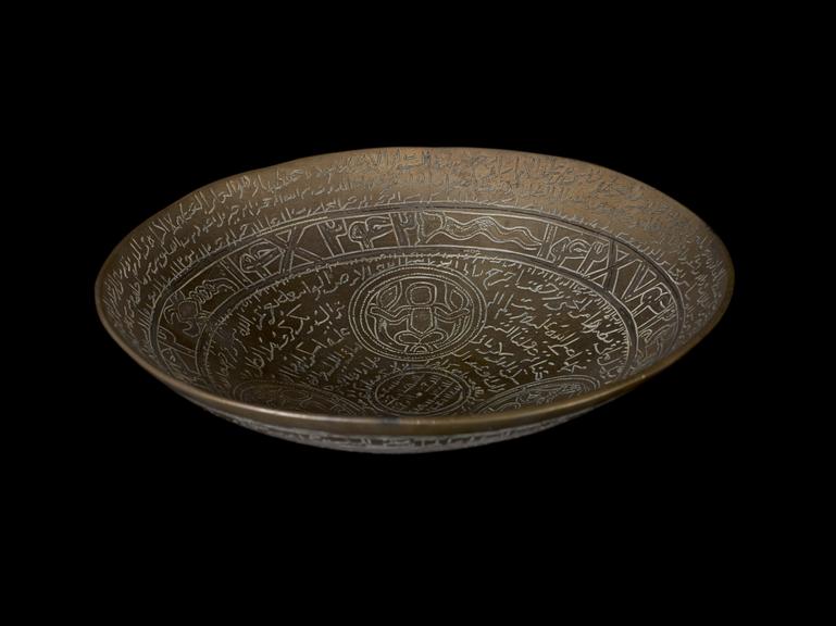 Brass divination bowl engraved with symbols and Arabic script | Science ...