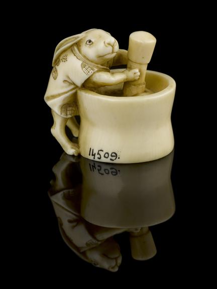 Netsuke in form of rabbit grinding with mortar and pestle | Science ...