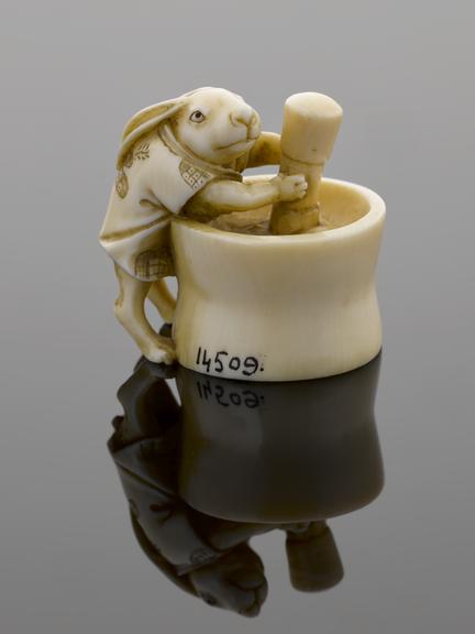 Netsuke in form of rabbit grinding with mortar and pestle | Science ...