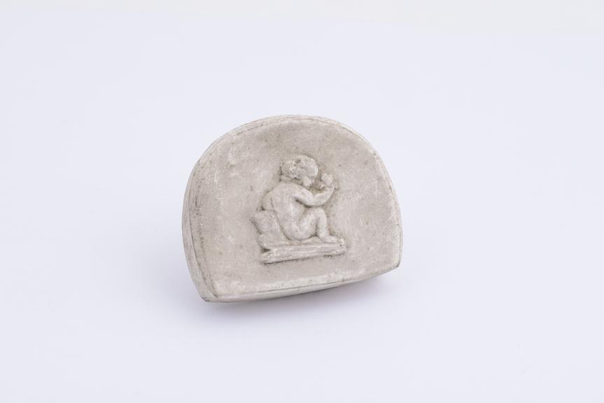 Plaster cast, seated child with flower | Science Museum Group Collection