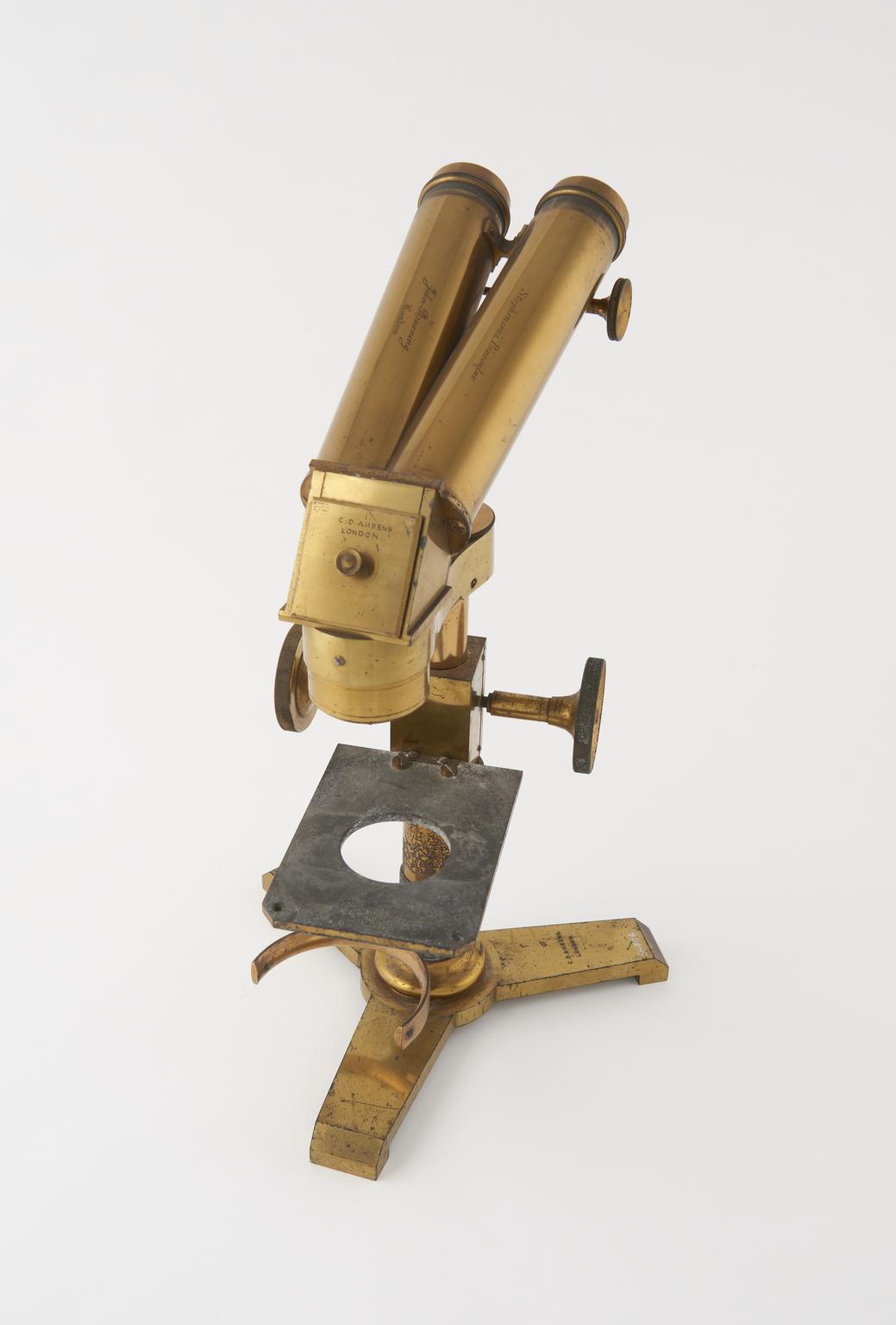 Binocular microscope with base and prism housing by C.D. Ahrens and ...