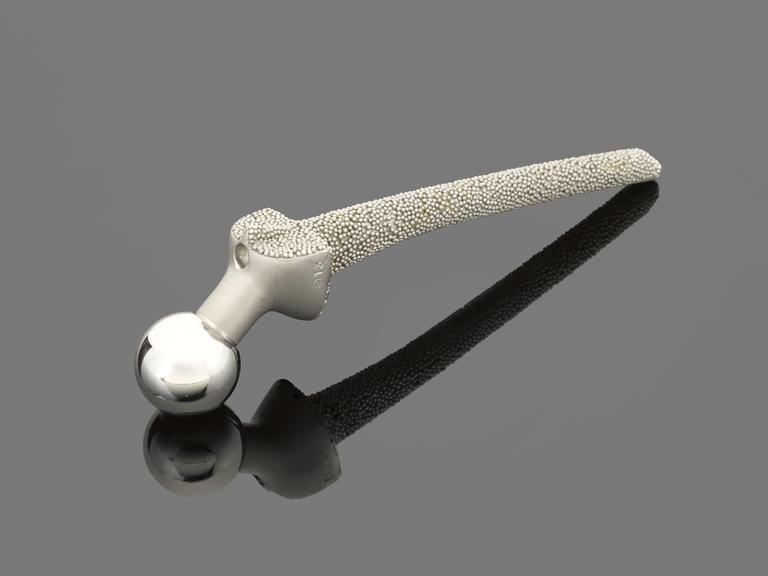 Modular hip prosthesis with textured femoral stem to aid bone grafting ...