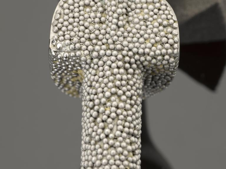 Modular hip prosthesis with textured femoral stem to aid bone grafting ...