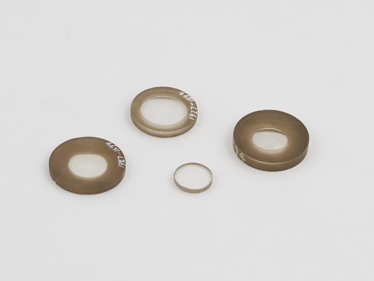 Three bi-concave lenses, one glass disc | Science Museum Group Collection