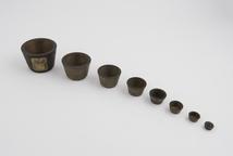 Conical nest of eight brass weights | Science Museum Group Collection