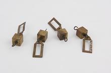 Four cubical weights with loops | Science Museum Group Collection
