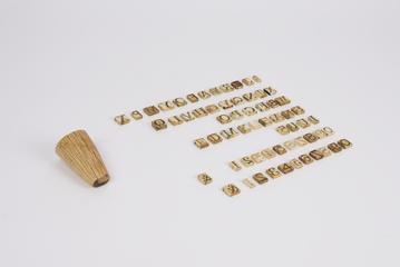 A collection of carved ivory printing letters and numbers | Science ...