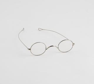 English 'invisible fused' bifocal spectacles with oval lenses and semi ...