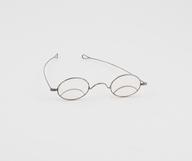 English metal frame spectacles with oval split segment bi-focal lenses ...