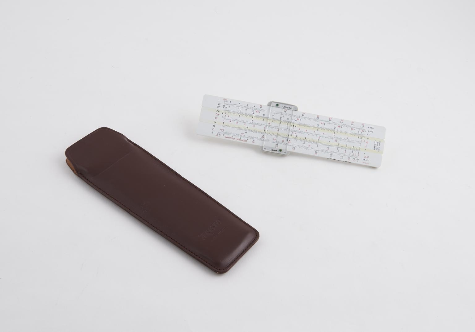Slide rule in white plastic with cursor | Science Museum Group Collection