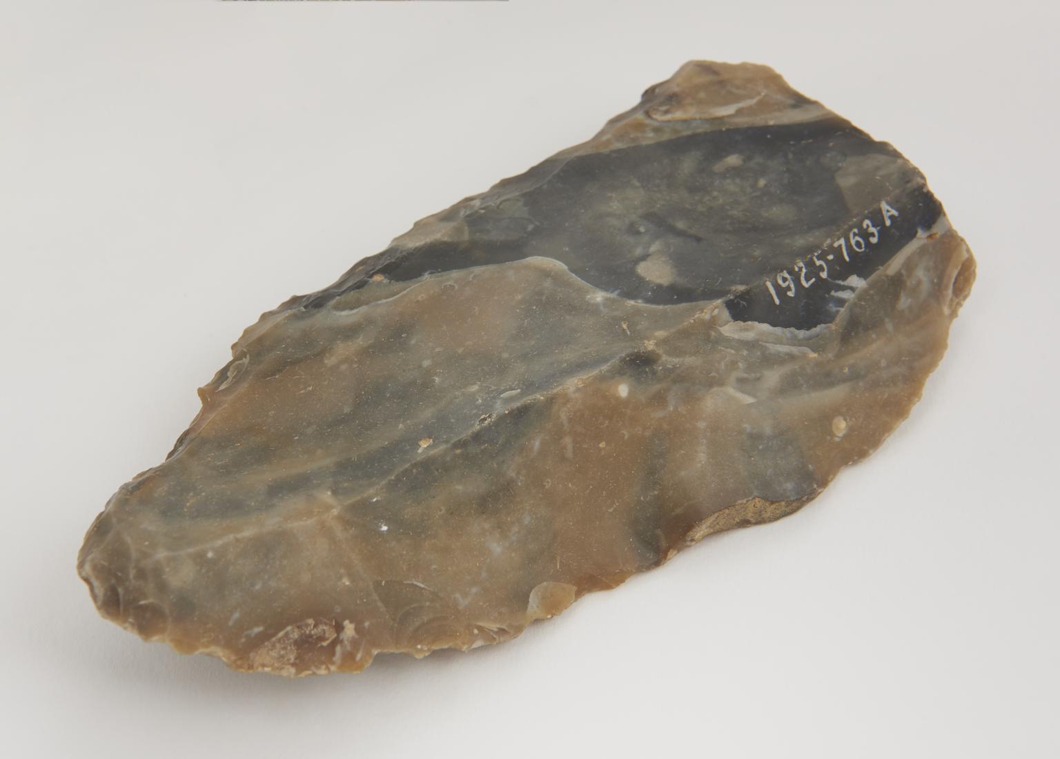 Flint hand tool, flake type, Stone Age. | Science Museum Group Collection
