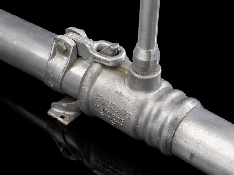 Full size irrigation sprinkler and short section of associated piping ...