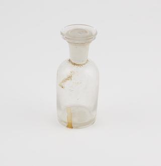 Chemical storage bottle and glass stopper | Science Museum Group Collection