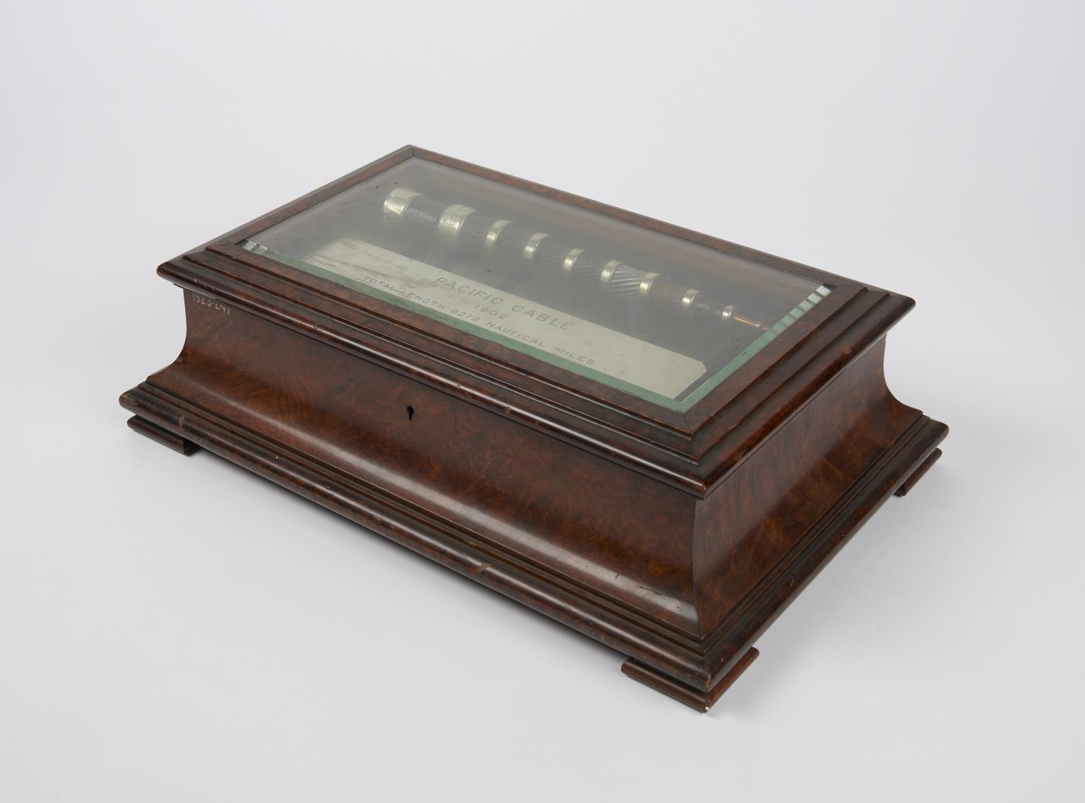 Specimen of Pacific cable, 1902, sectioned, in glazed display case ...