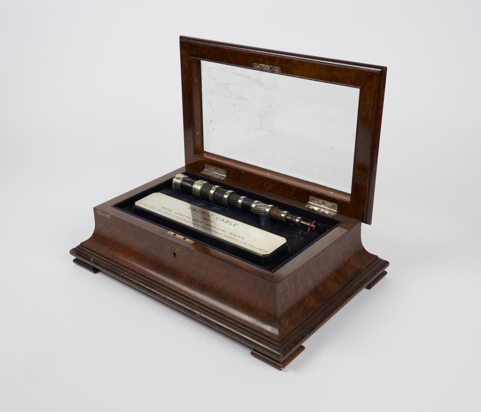 Specimen of Pacific cable, 1902, sectioned, in glazed display case ...