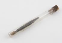 Suture needle and suture in glass tube | Science Museum Group Collection