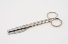 A pair of circumcision scissors with one cleft blade and one narrow ...