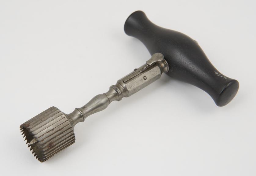 Cranial trephine with wooden handle | Science Museum Group Collection