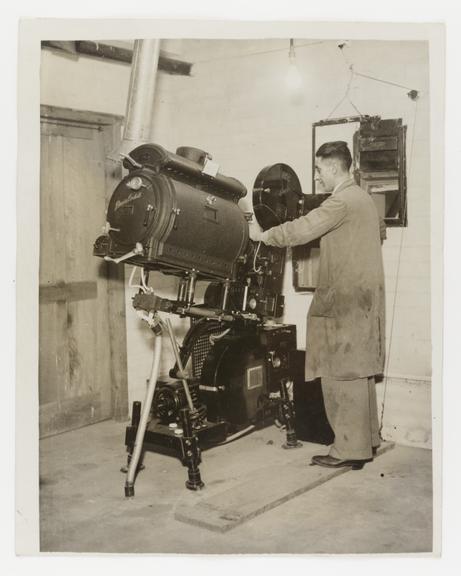 Photograph of a projectionist at work | Science Museum Group Collection