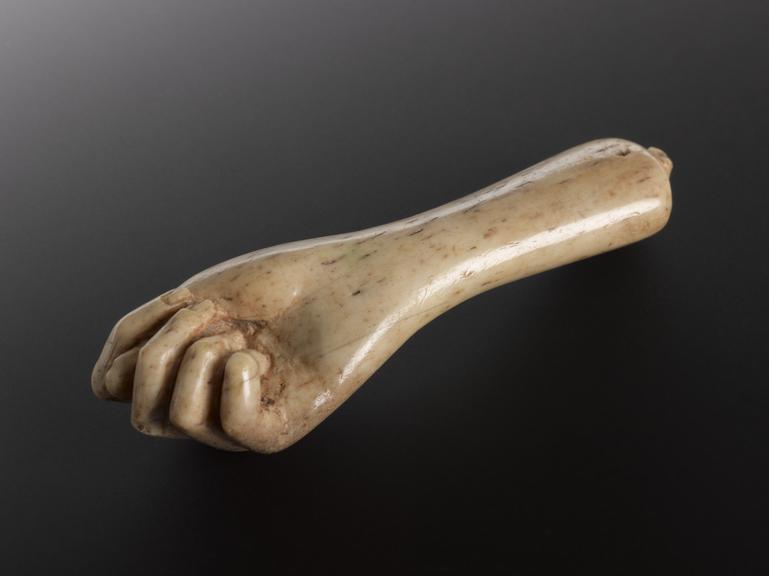 Bone amulet in the shape of a hand and arm | Science Museum Group ...