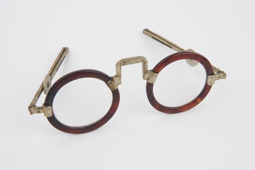 Chinese spectacles with round flat lenses and two-piece side-arms ...
