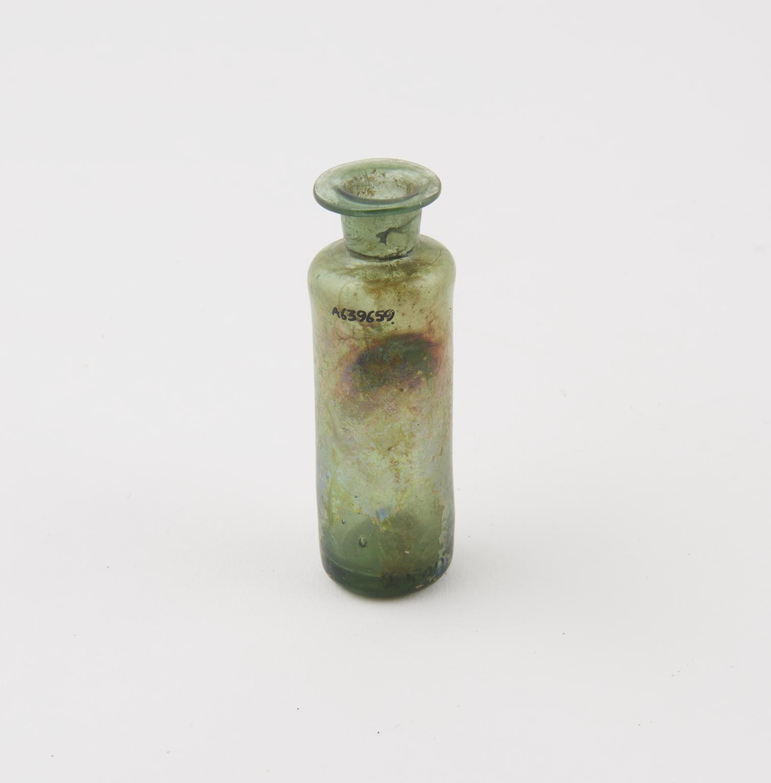 18 iridescent green glass bottles, cylindrical, handblown, with pontil ...