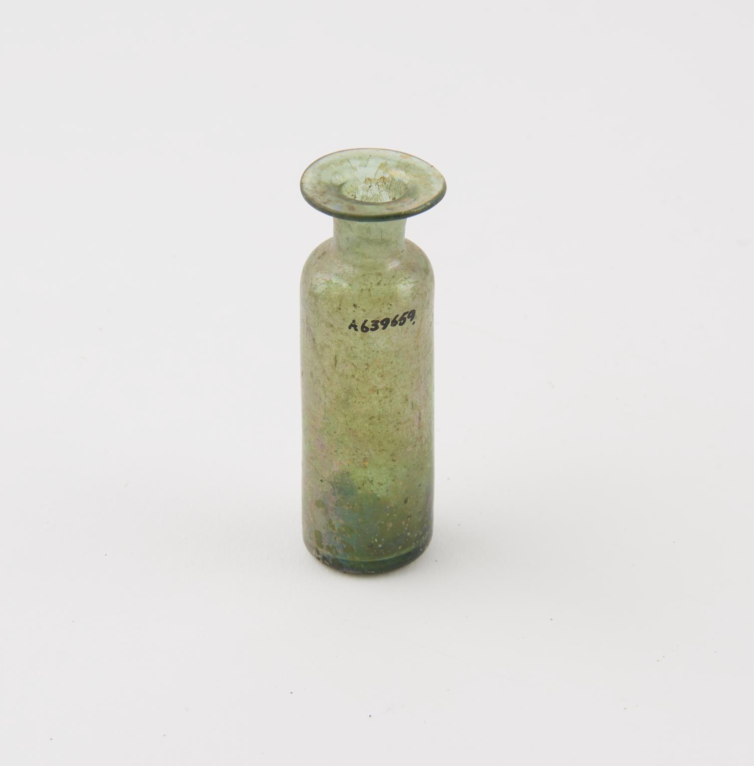 18 iridescent green glass bottles, cylindrical, handblown, with pontil ...