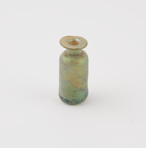 Cylindrical, iridescent, green glass bottle | Science Museum Group ...