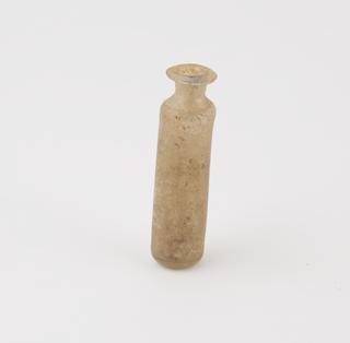 Glass bottle, cylindrical, weathered | Science Museum Group Collection