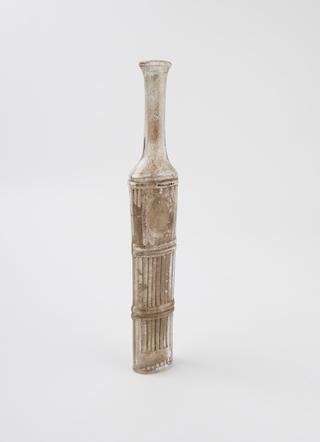 Fluted clear glass bottle with long neck | Science Museum Group Collection