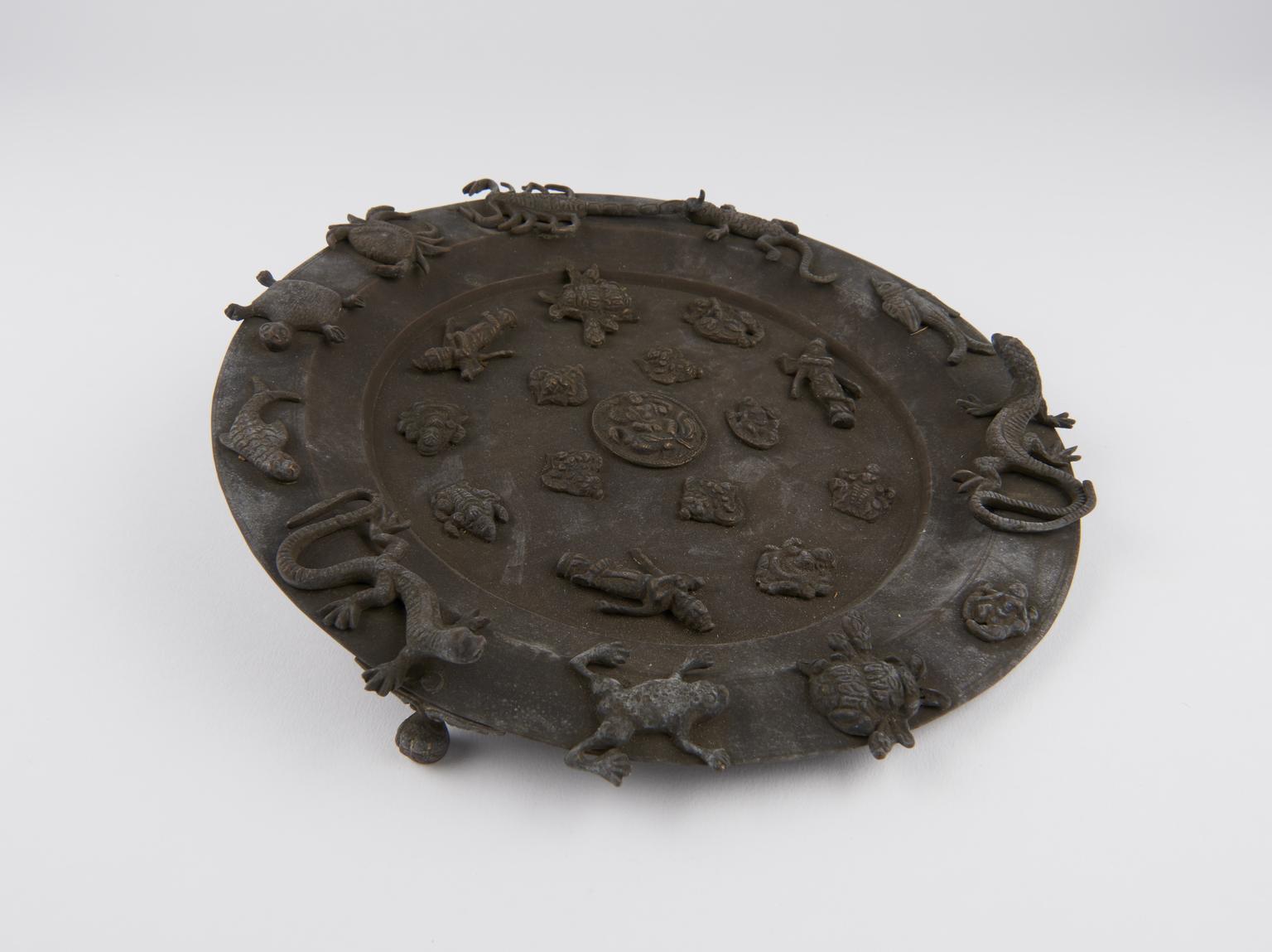 Temple plate with applied cast animals | Science Museum Group Collection