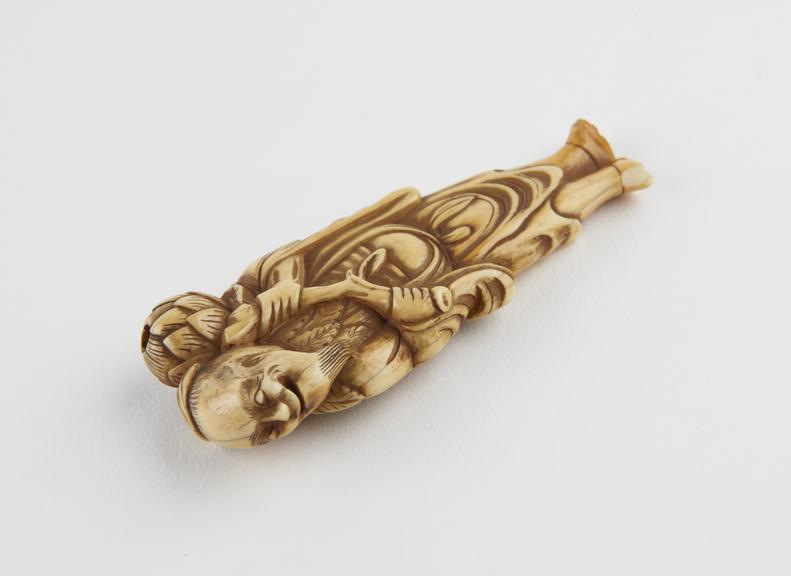 Netsuke in form of Sennin holding lotus flower | Science Museum Group ...