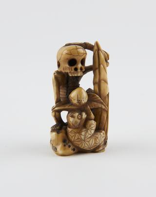 Netsuke in form of skeleton with Tanuki the Japanese raccoon dog ...