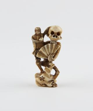 Netsuke in form of skeleton holding fan and Tanuki the badger | Science ...