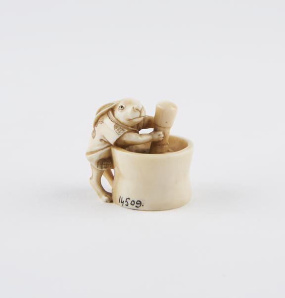 Netsuke in form of rabbit grinding with mortar and pestle | Science ...