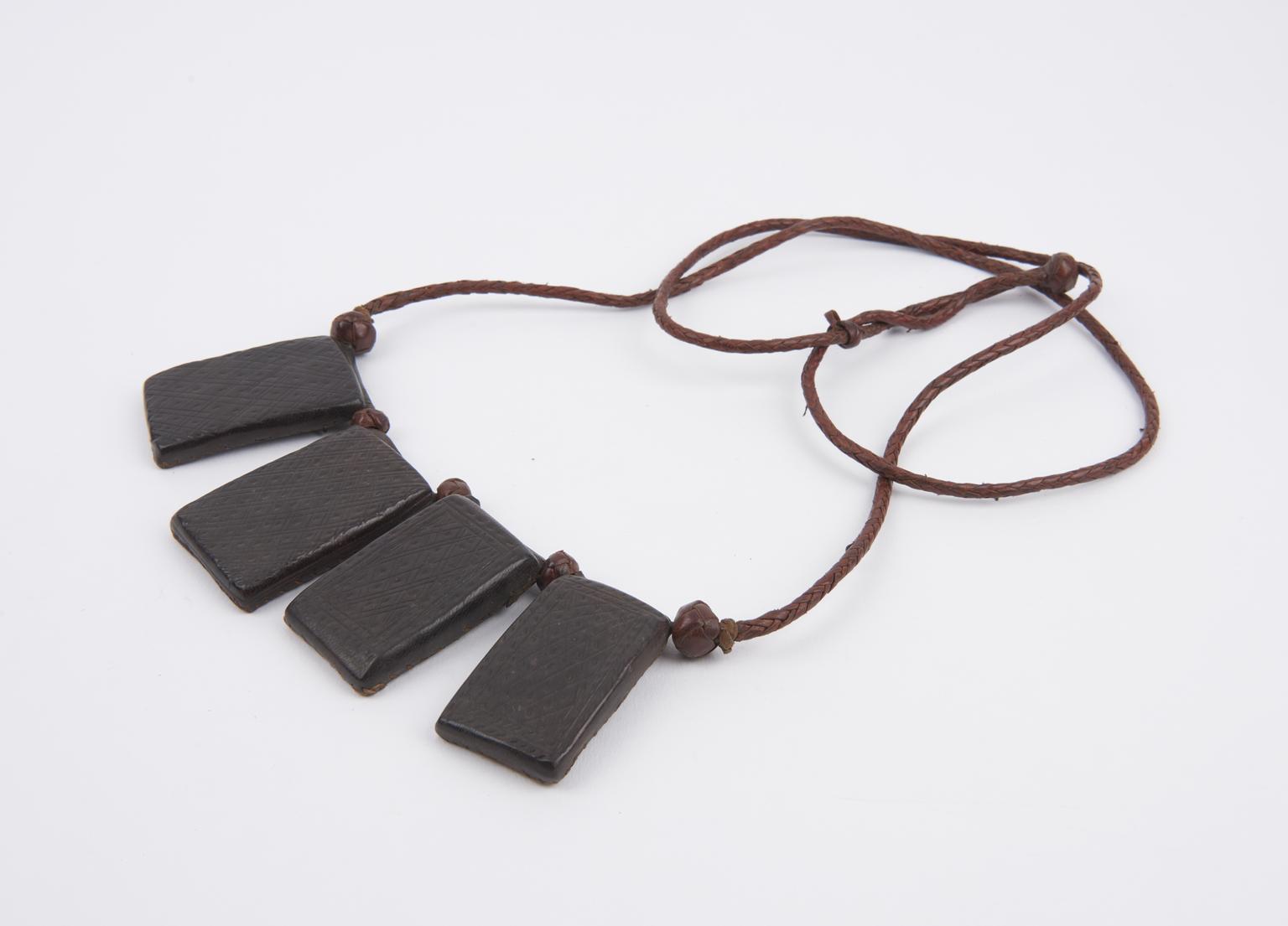 4 stitched leather amulet cases with tooled geometric designs | Science ...