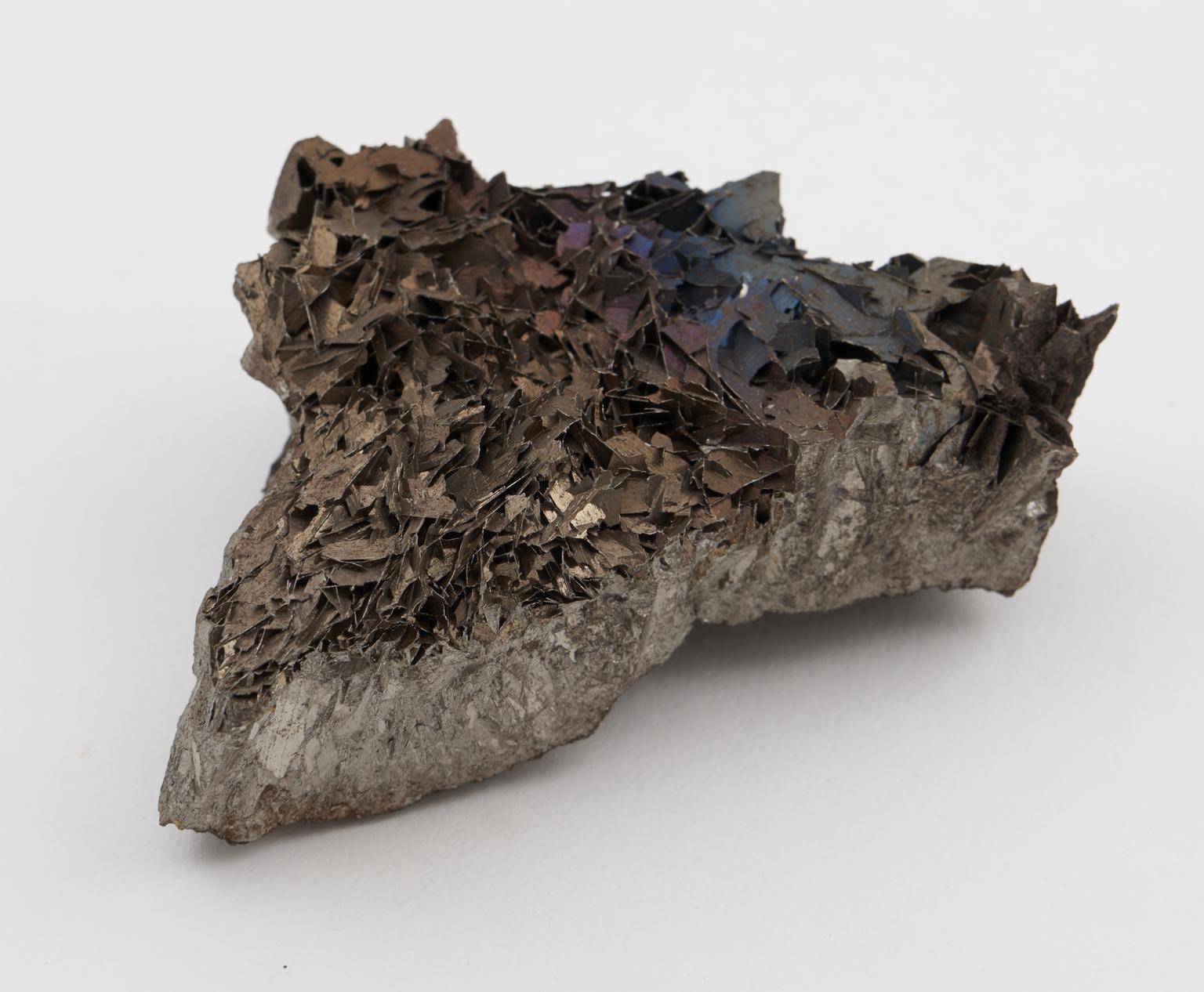 Spiegeleisen with a crystalline surface of thin iridescent laminae ...