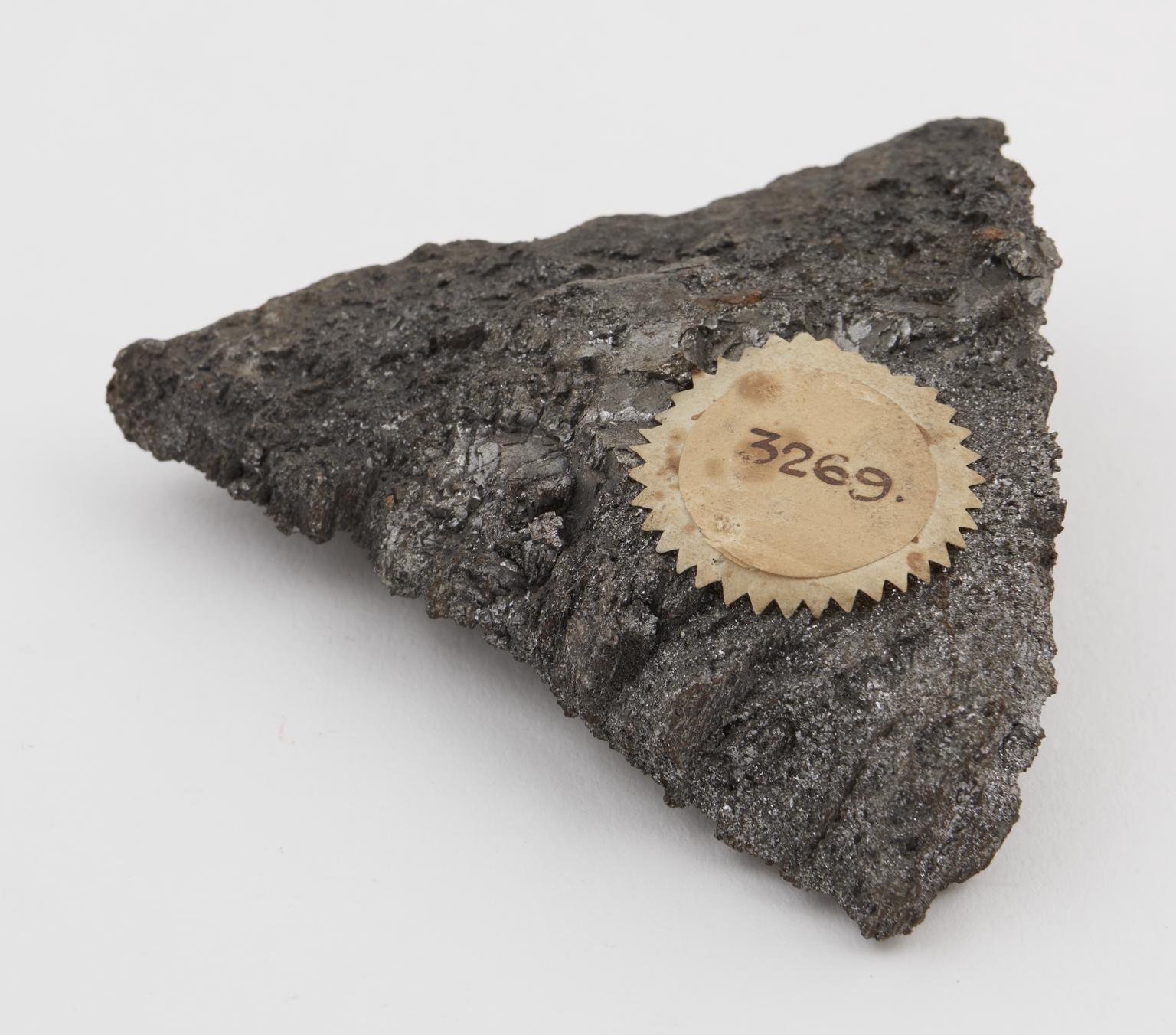 Pig of cast iron, showing a layer of larger crystals at some depth from ...