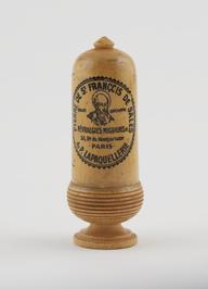 Small cone shaped menthol stone contained in boxwood elongated acorn ...